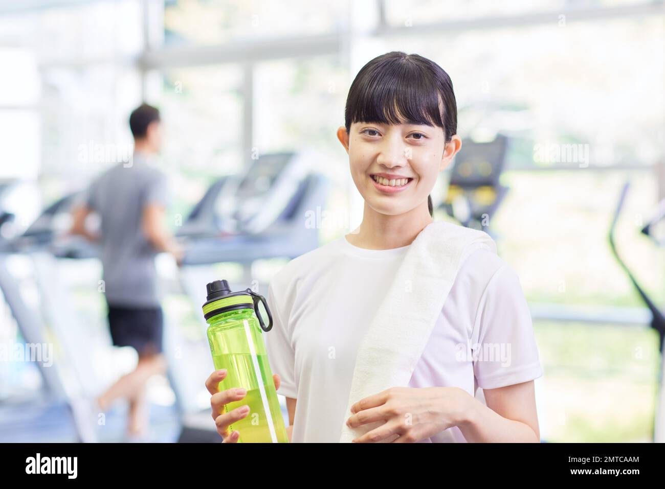 Japanese woman training at indoor gym Stock Photo - Alamy