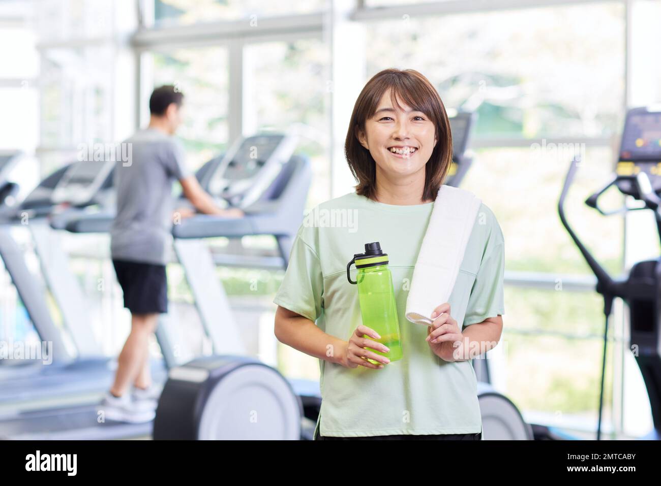 Japanese woman training at indoor gym Stock Photo - Alamy