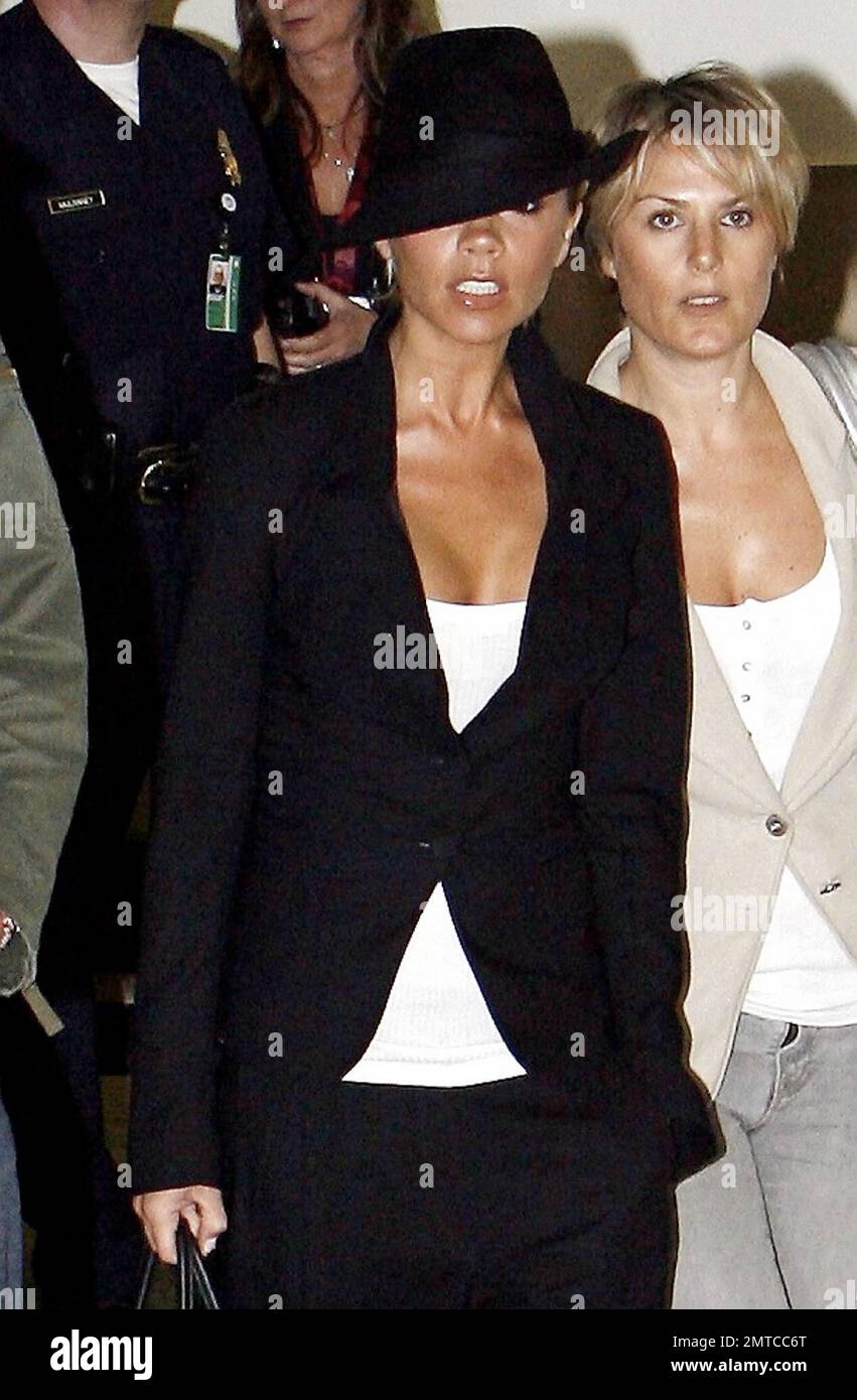 A sleepy looking Posh arrives at the airport in Los Angeles, Calif ...