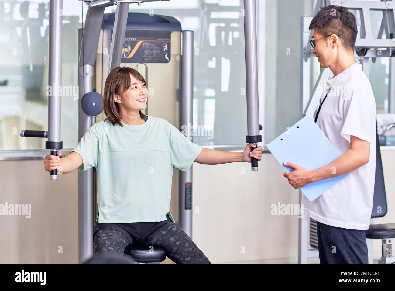 Japanese woman training at indoor gym Stock Photo - Alamy