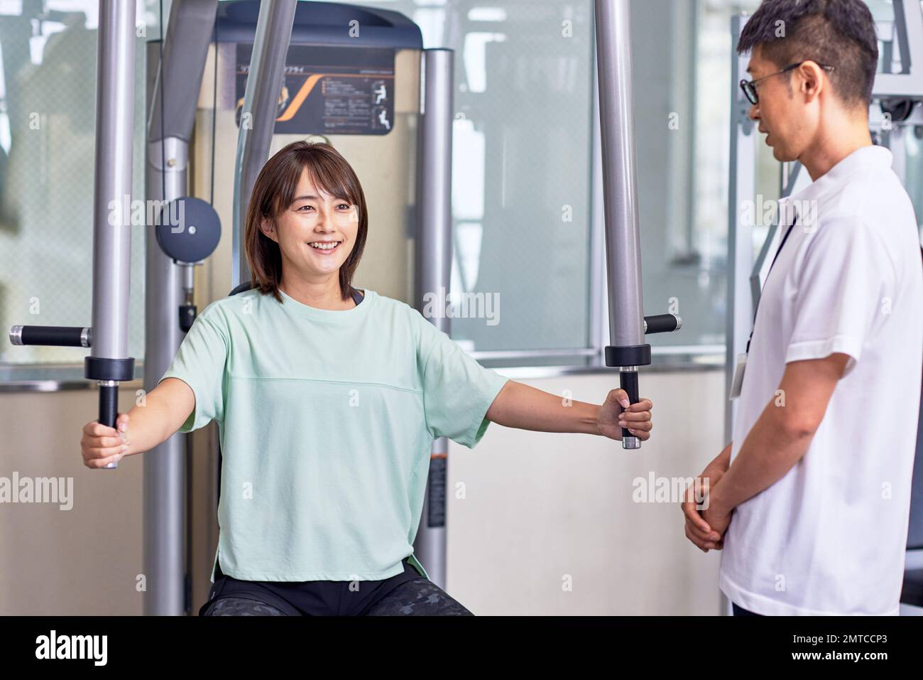 Japanese woman training at indoor gym Stock Photo - Alamy