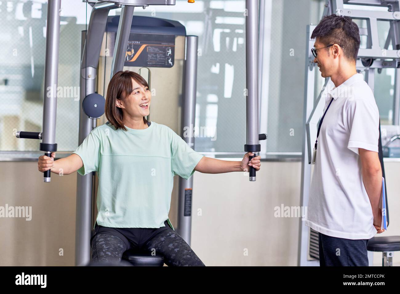 Japanese woman training at indoor gym Stock Photo - Alamy