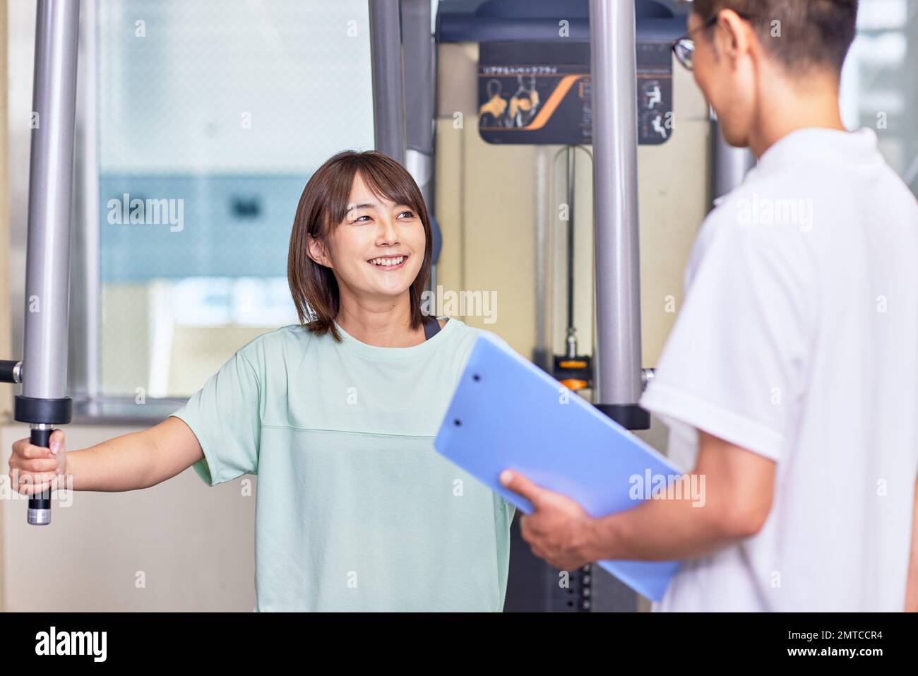 Japanese woman training at indoor gym Stock Photo - Alamy