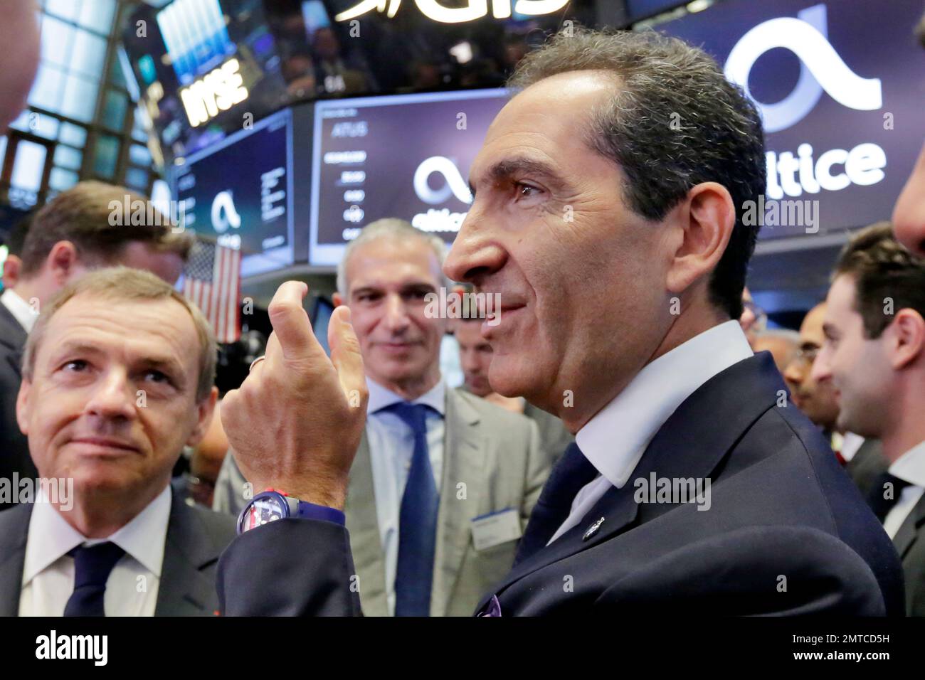 Altice founder Patrick Drahi, right, waits with company executives for ...