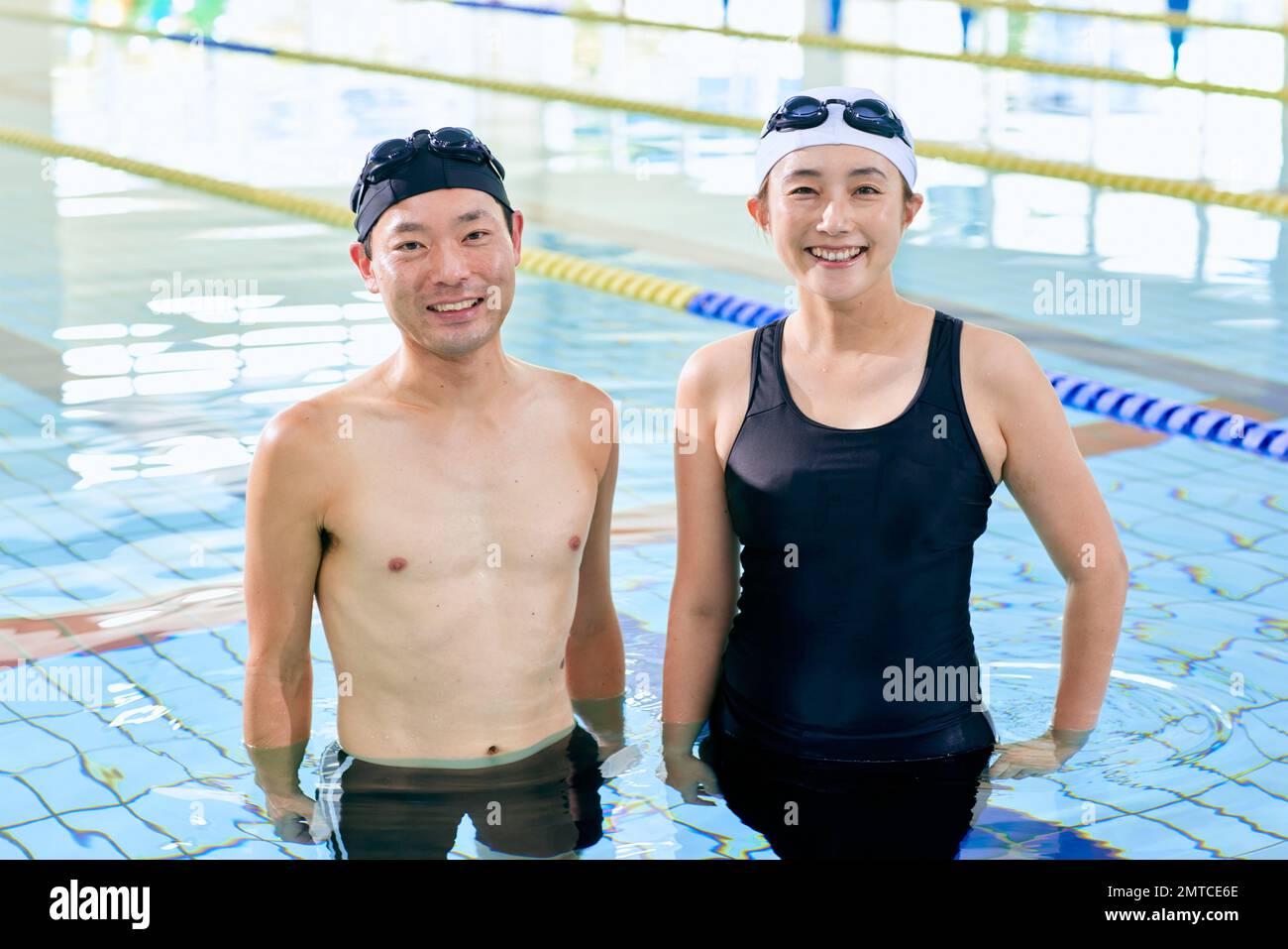 Japanese couple at indoor swimming pool Stock Photo - Alamy