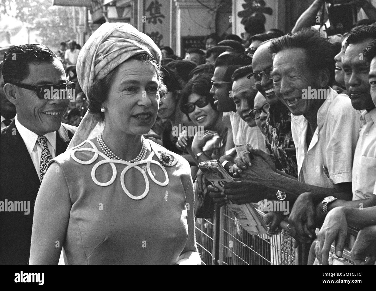 Queen Elizabeth II seen with some of the inhabitants during her visit ...
