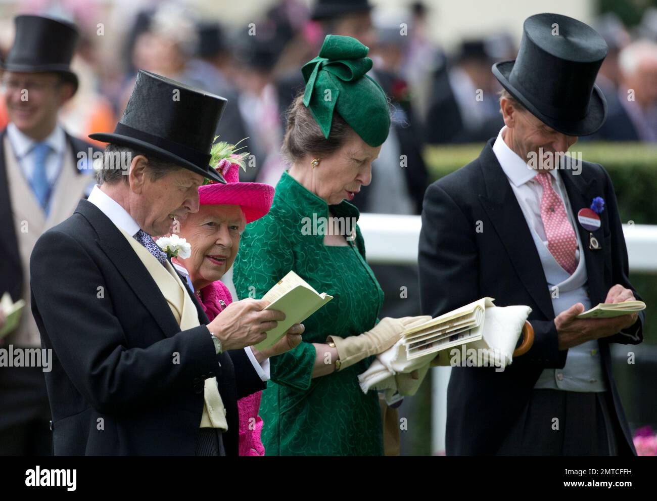 Britain's Queen Elizabeth II, second left, with her horse racing ...