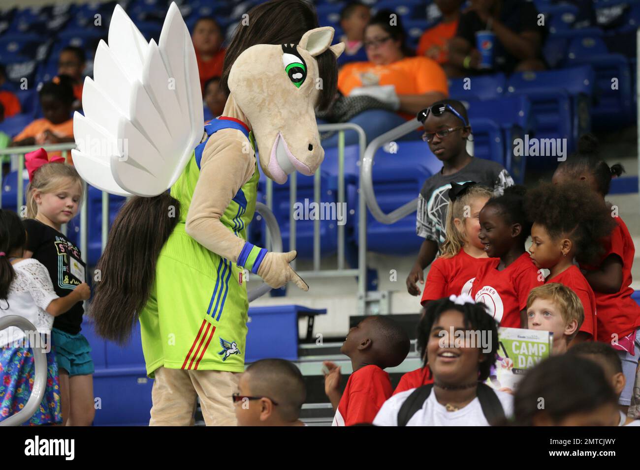 The Dallas Wings mascot entertains children in the stands before a WNBA ...