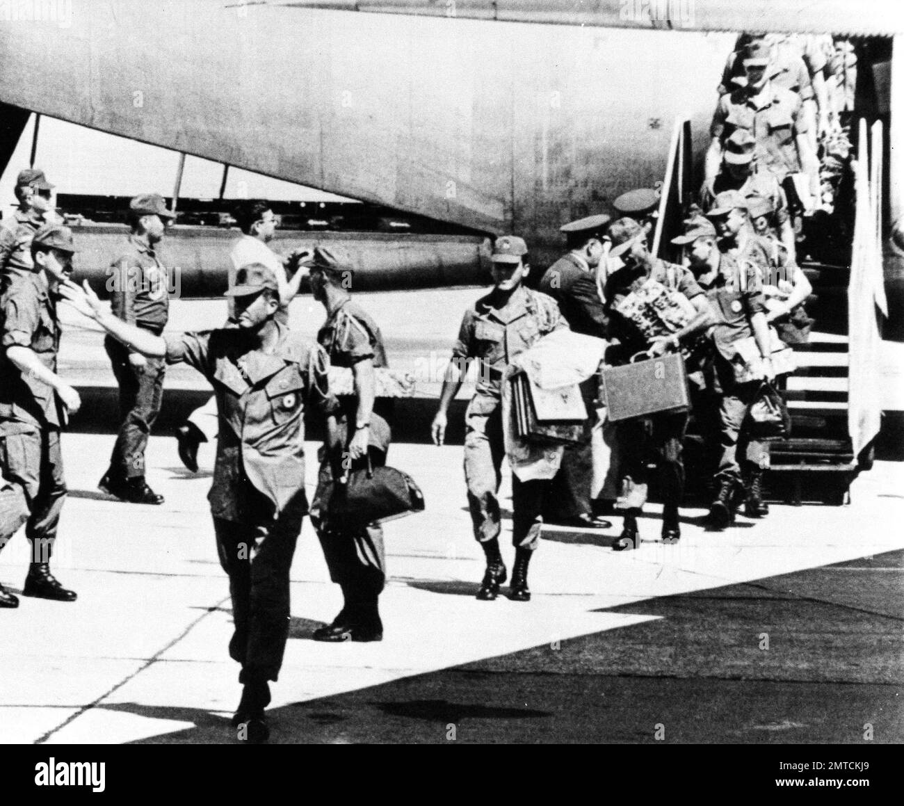 Battalion Commander Lt. Col. Petersen waves to the people on hand to ...