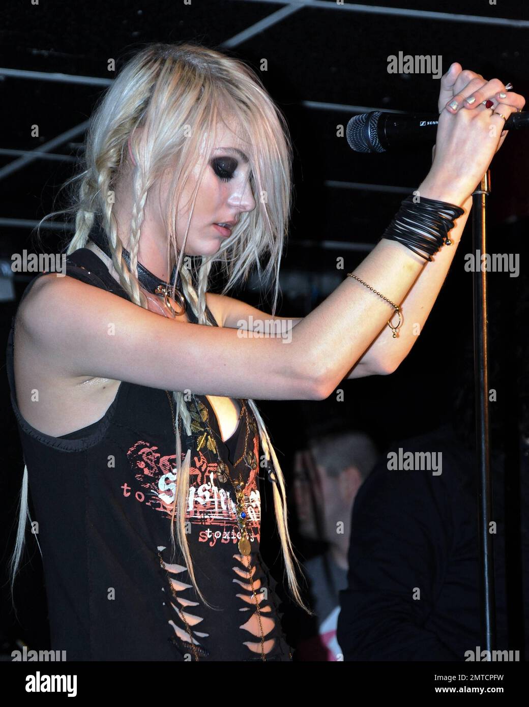 Wearing a black leather jacket and torn t-shirt made into a dress ...