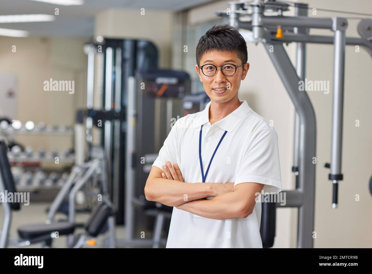 Japanese trainer at indoor gym Stock Photo - Alamy