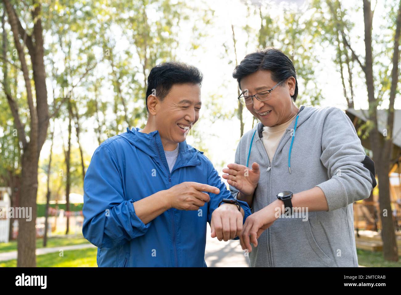 The two movements of older men look at sports watch Stock Photo - Alamy