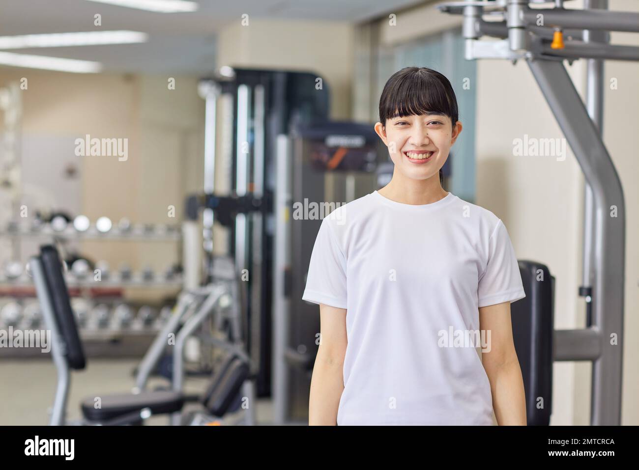 Japanese woman training at indoor gym Stock Photo - Alamy