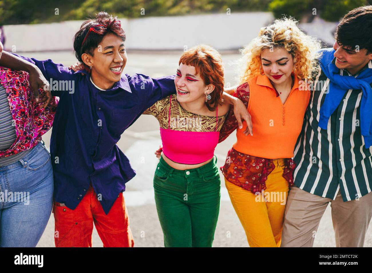 Young diverse friends having fun outdoor laughing together - Soft focus ...