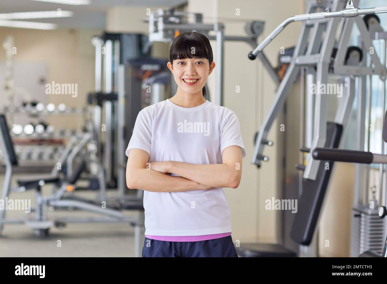 Japanese woman training at indoor gym Stock Photo - Alamy