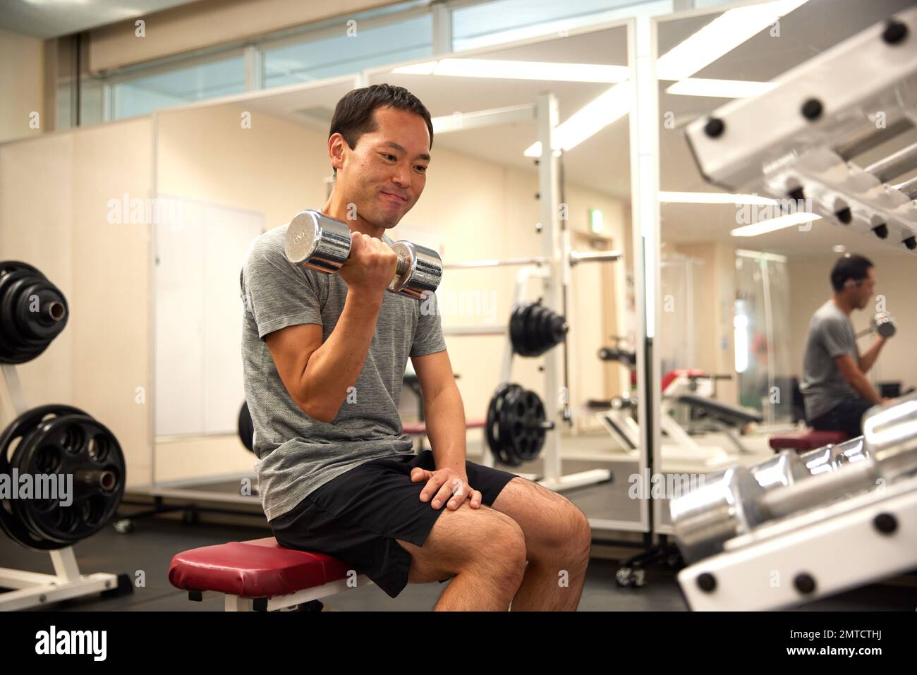 Japanese man training at indoor gym Stock Photo - Alamy