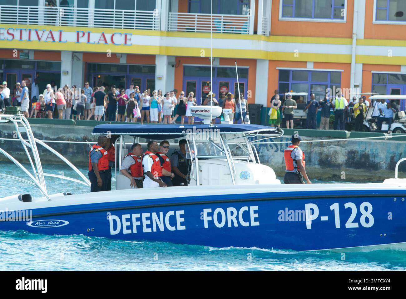 Britain's Prince Harry boards a Royal Bahamas Defence Force speed boat ...