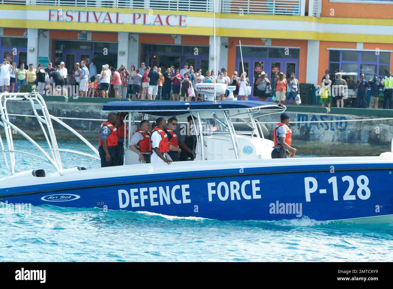 Britain's Prince Harry boards a Royal Bahamas Defence Force speed boat ...