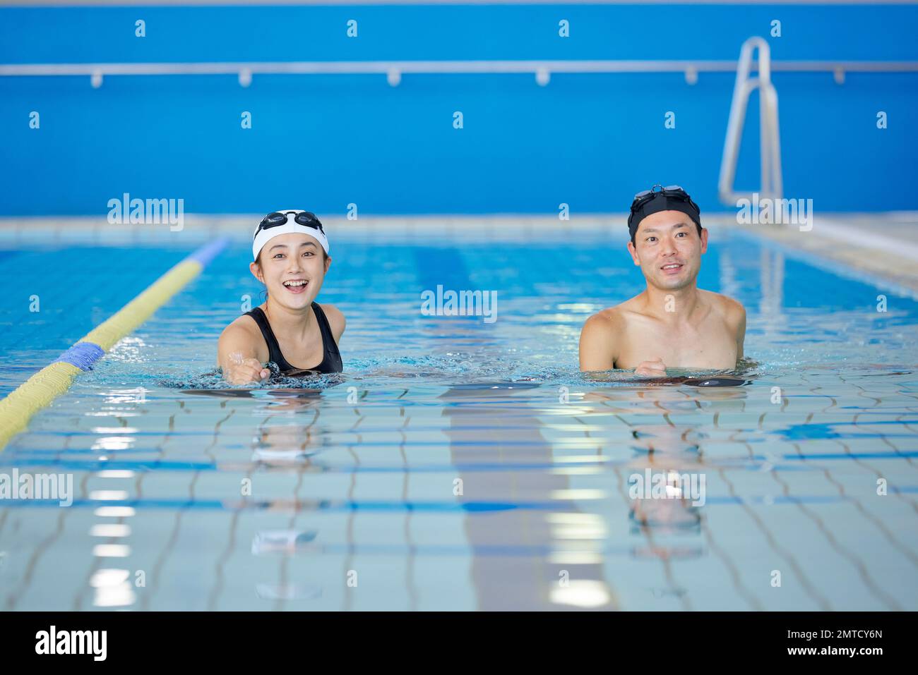 Japanese couple at indoor swimming pool Stock Photo - Alamy
