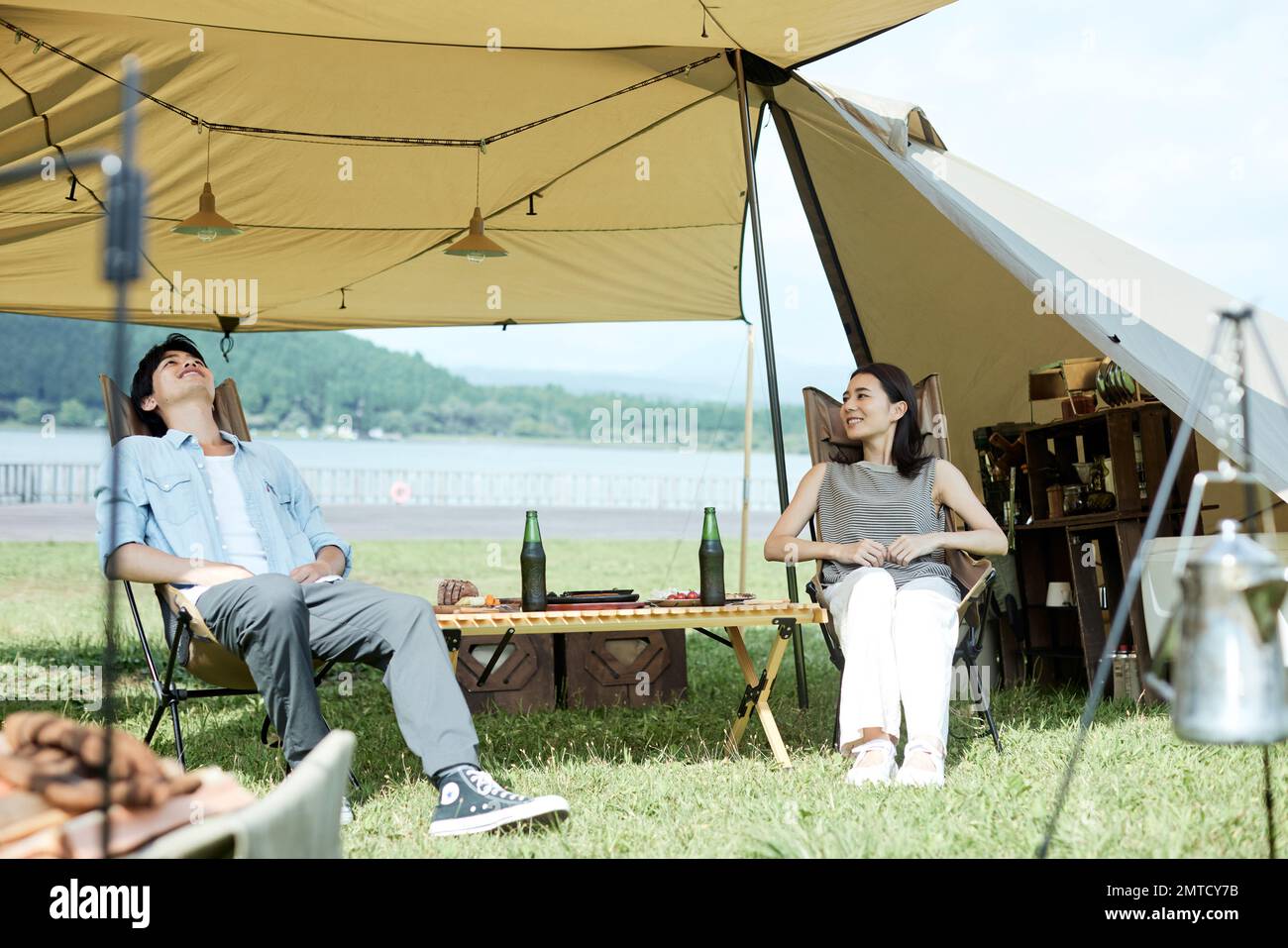 Young Japanese couple at campsite Stock Photo - Alamy