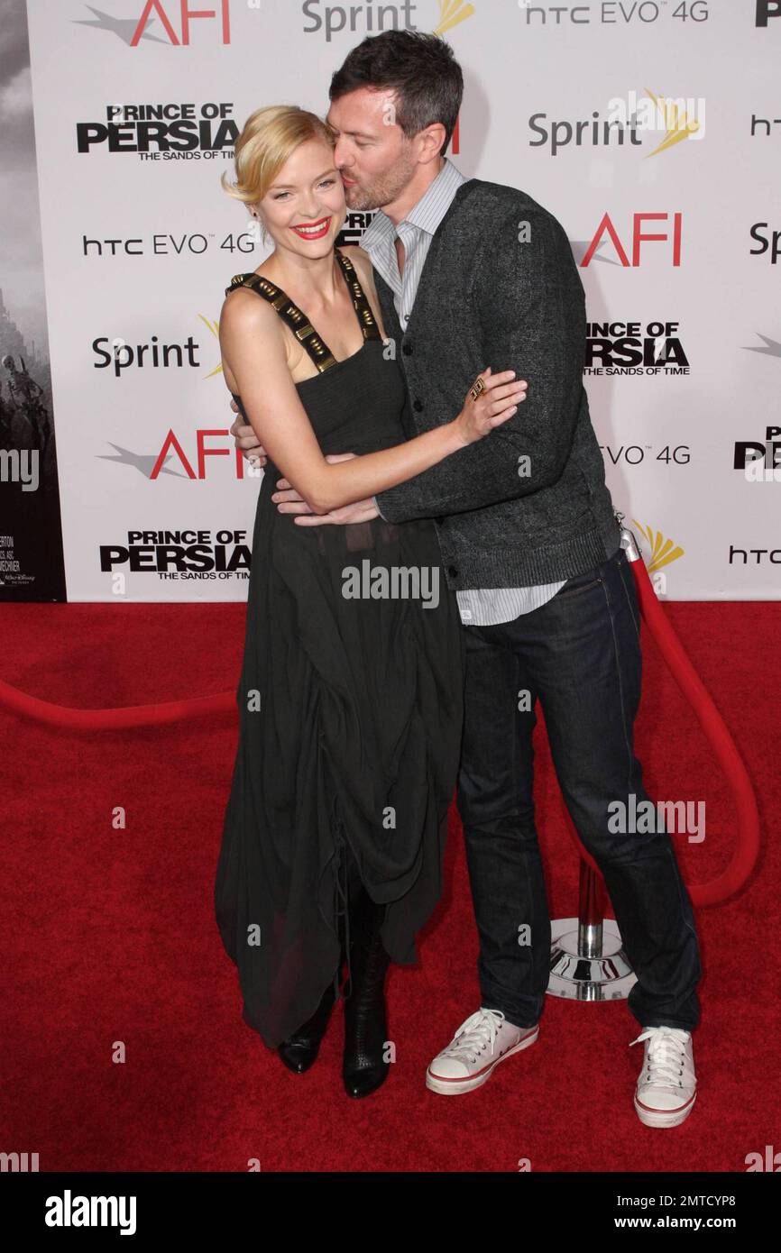 Jaime King gets a kiss from her husband Kyle Newman as she walks the ...