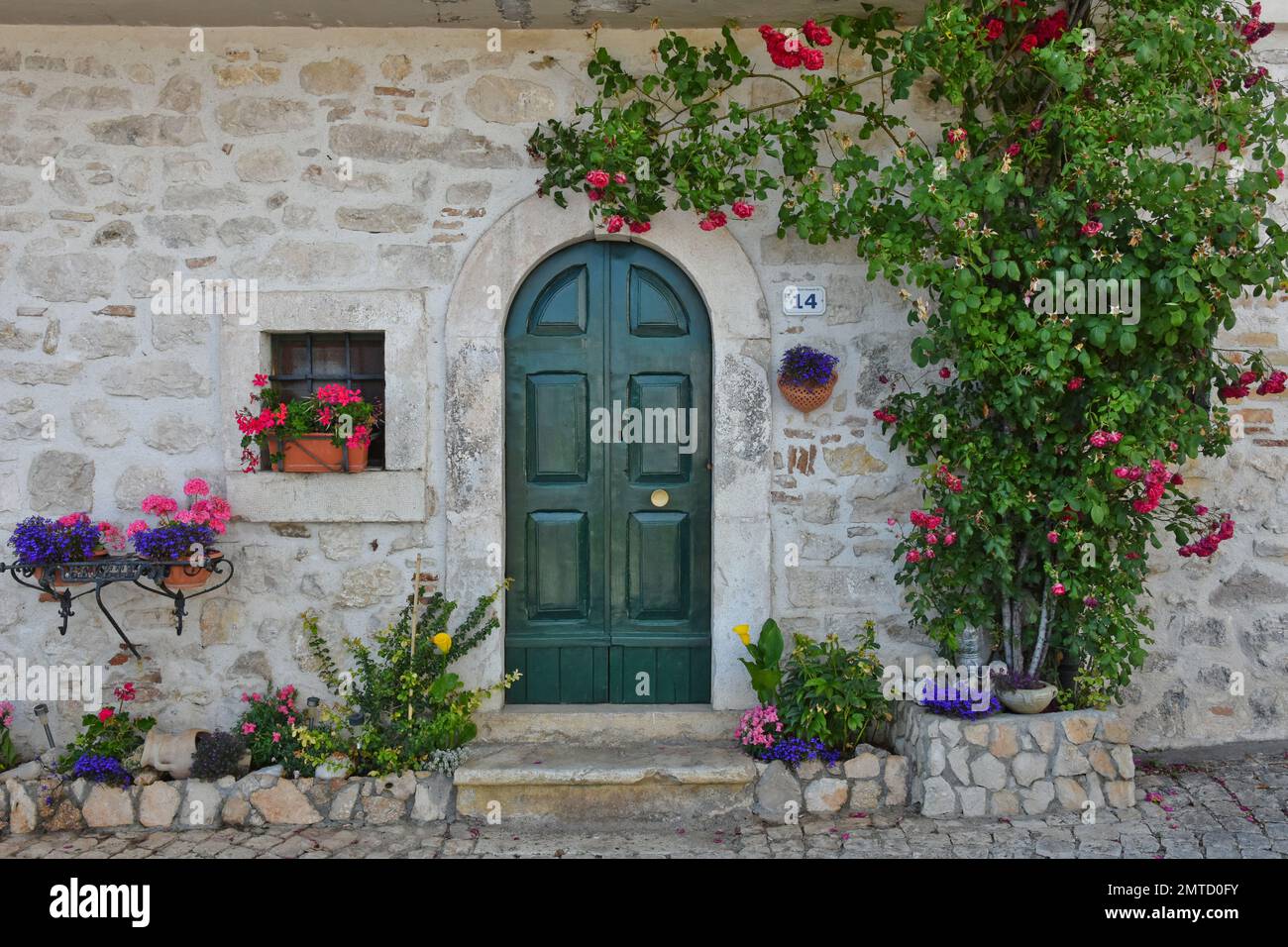 Facade of a house with flowers hi-res stock photography and images - Alamy