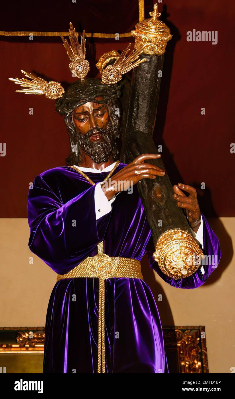 Paso with a statue of Jesus Christ dragging a wooden cross during a ...