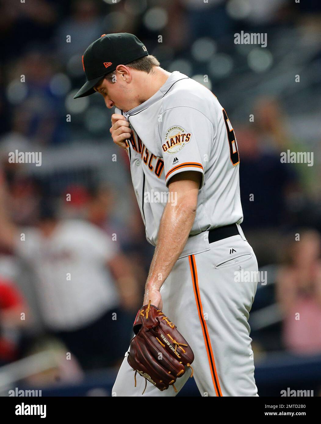 San Francisco Giants relief pitcher Derek Law paces on the mound in the ...