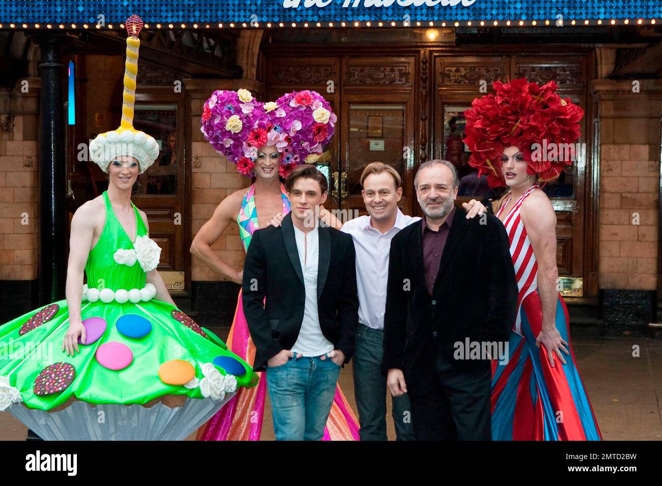 (L-R) Oliver Thornton, Jason Donovan and John Bowe pose with ...