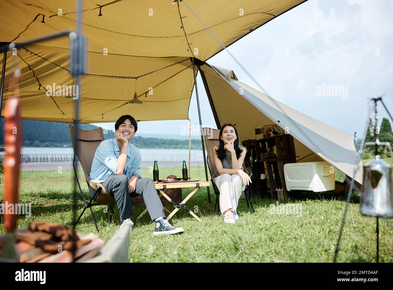 Young Japanese couple at campsite Stock Photo - Alamy