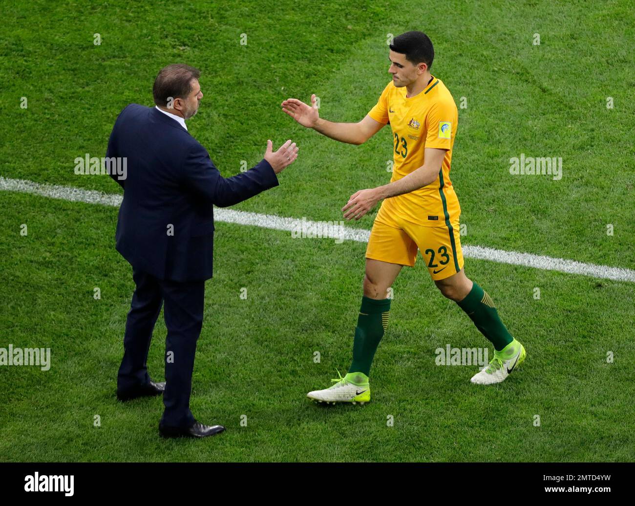 Australia's Tomas Rogic shakes hand with Australia coach Ange ...