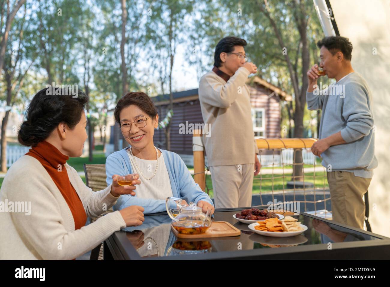 Drinking tea and chatting in old people in the camp Stock Photo - Alamy