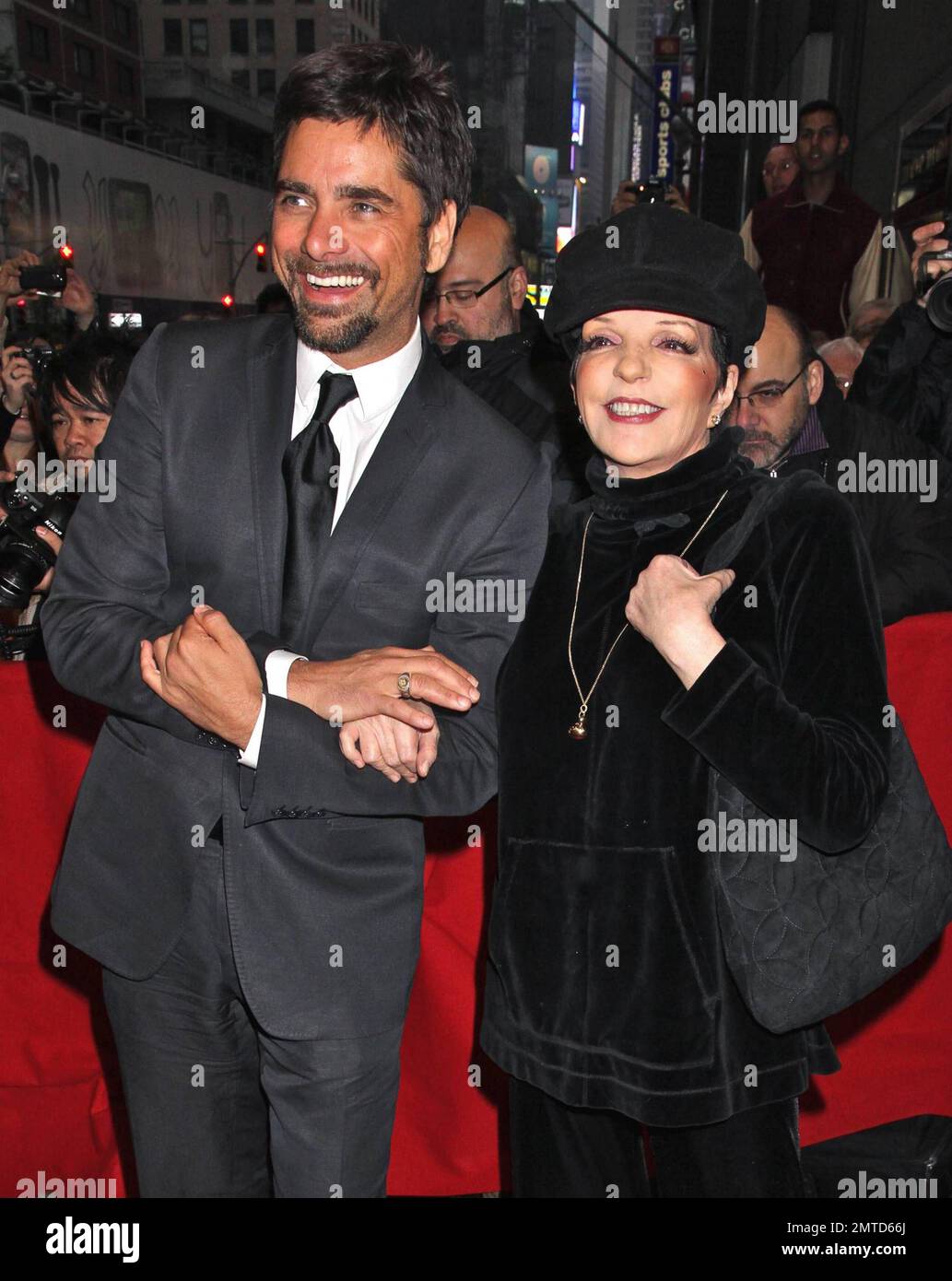 John Stamos escorts Liza Minnelli to the premiere of the Broadway ...
