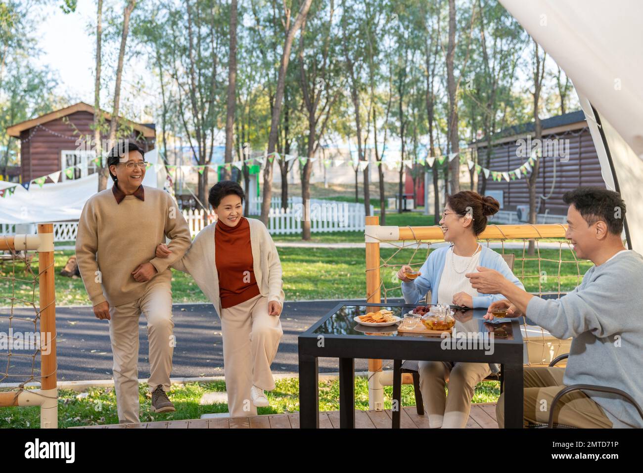 Drinking tea and chatting in old people in the camp Stock Photo - Alamy