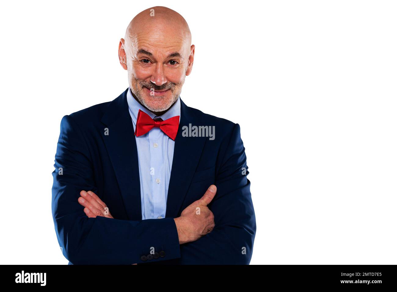 Studio portrait of mid aged man wearing bow tie and blazer while ...
