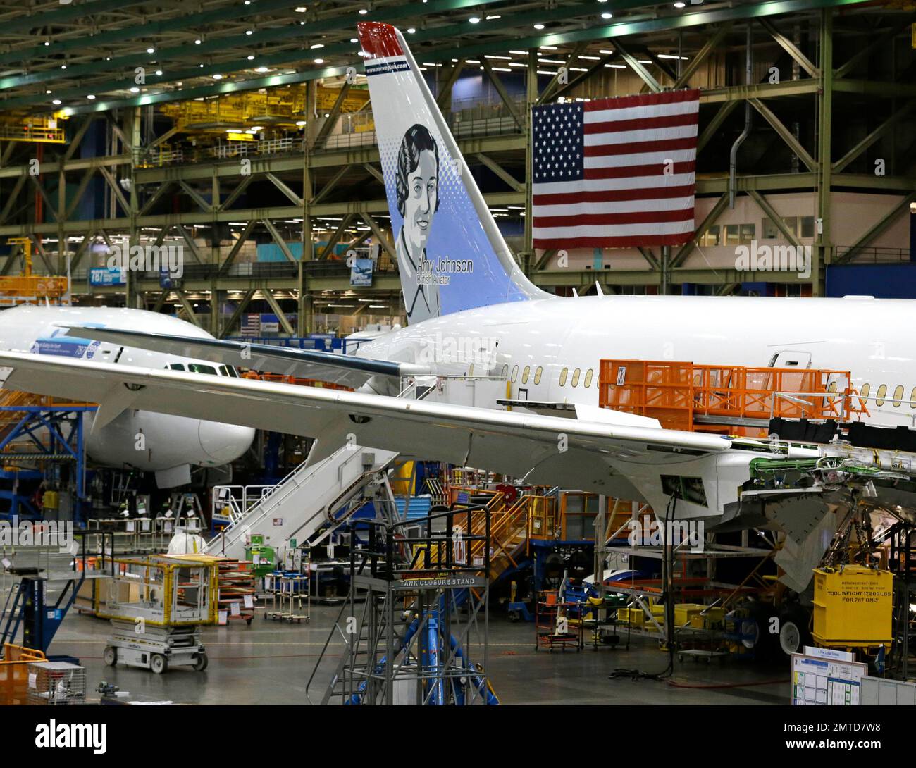 A U.S. flag is displayed above a Boeing 787 airplane being built for ...