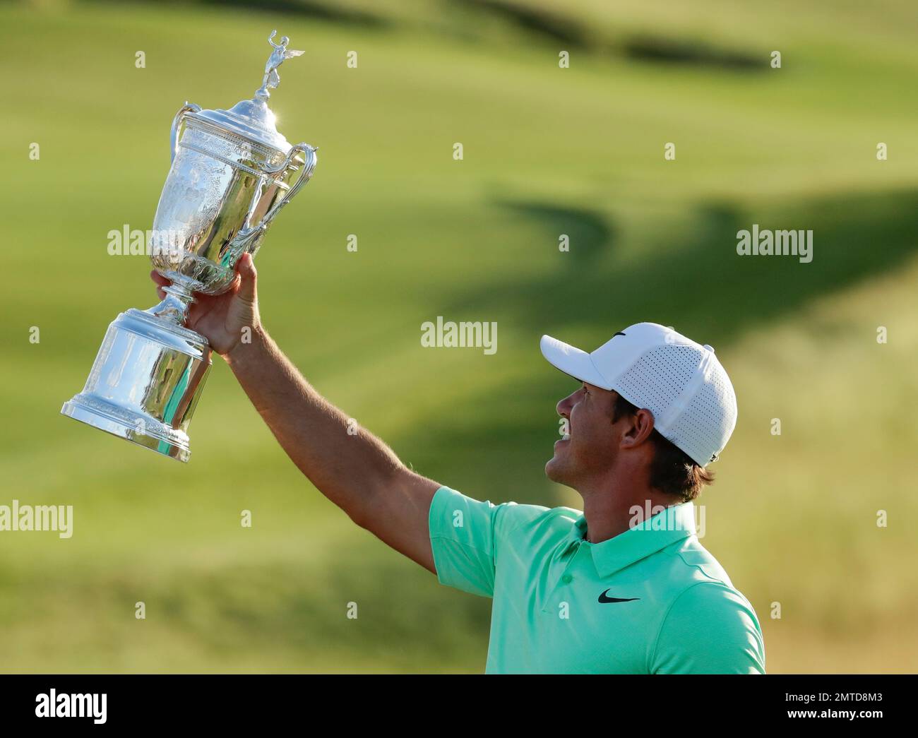 Brooks Koepka poses with the winning trophy after the U.S. Open golf ...