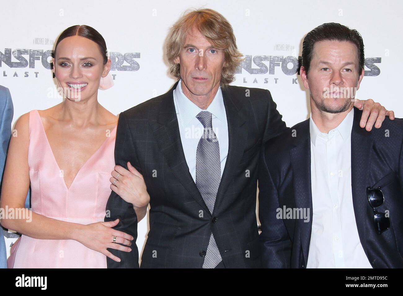 Laura Haddock, Michael Bay and Mark Wahlberg pose for photographers ...