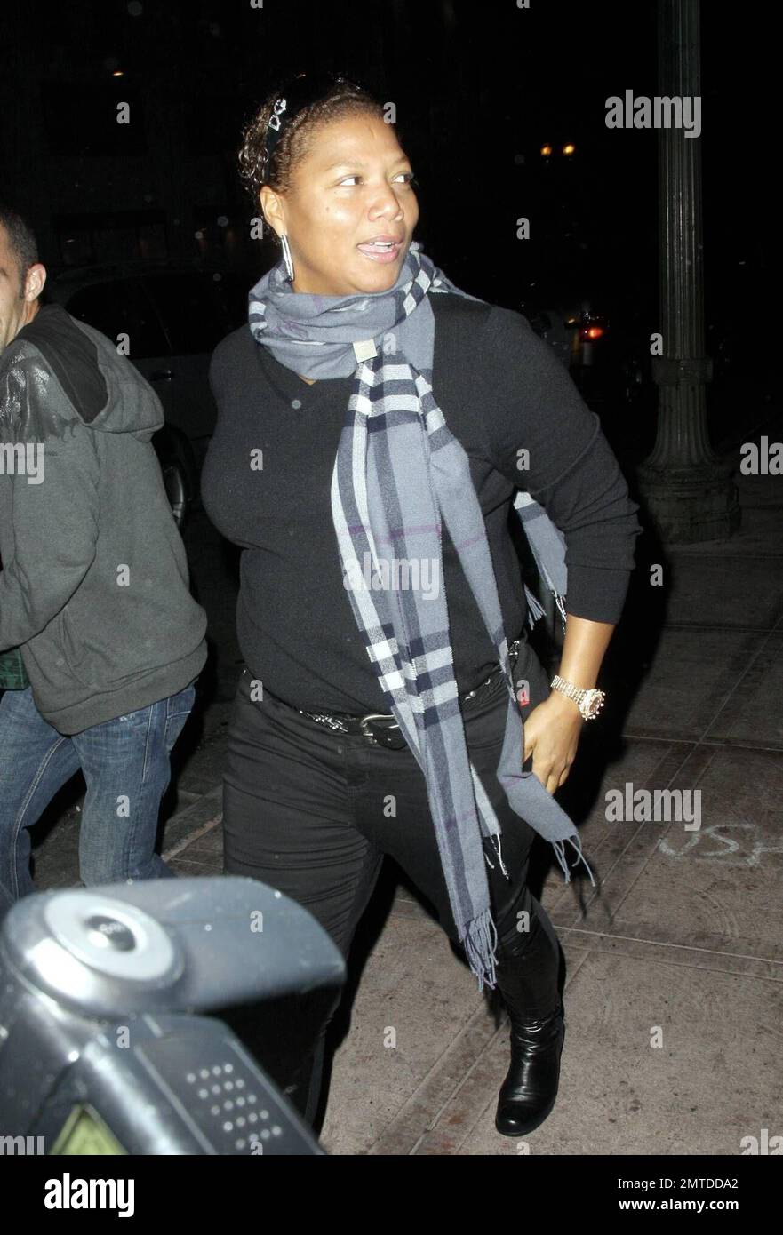 Singer, rapper and actress Queen Latifah flashes a peace sign and talks ...