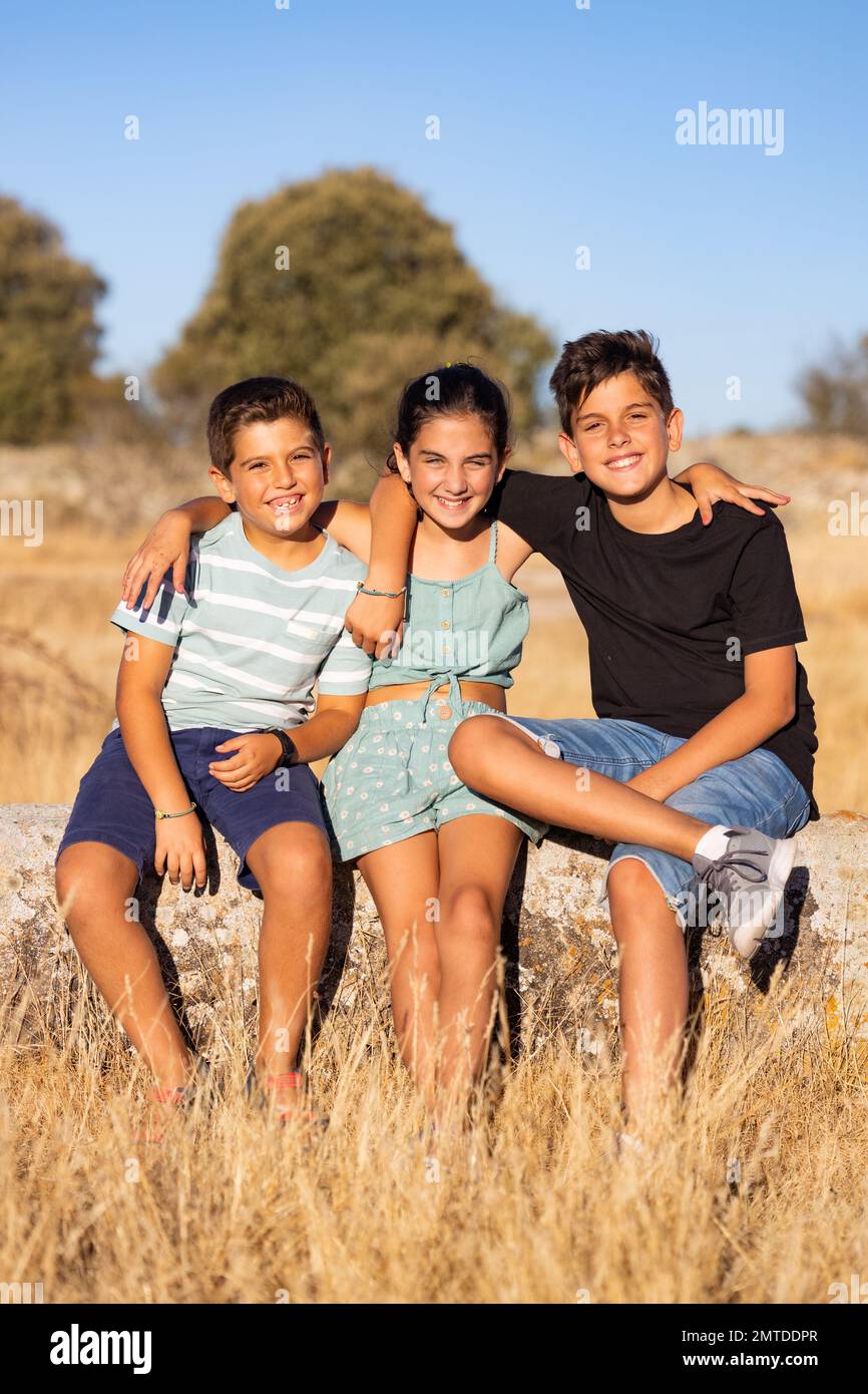 Three children enjoying their summer vacation in the countryside Stock ...