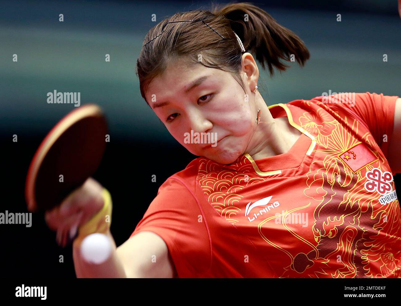 Chen Meng of China returns a shot against Han Ying of Germany during their women's semi-final ...