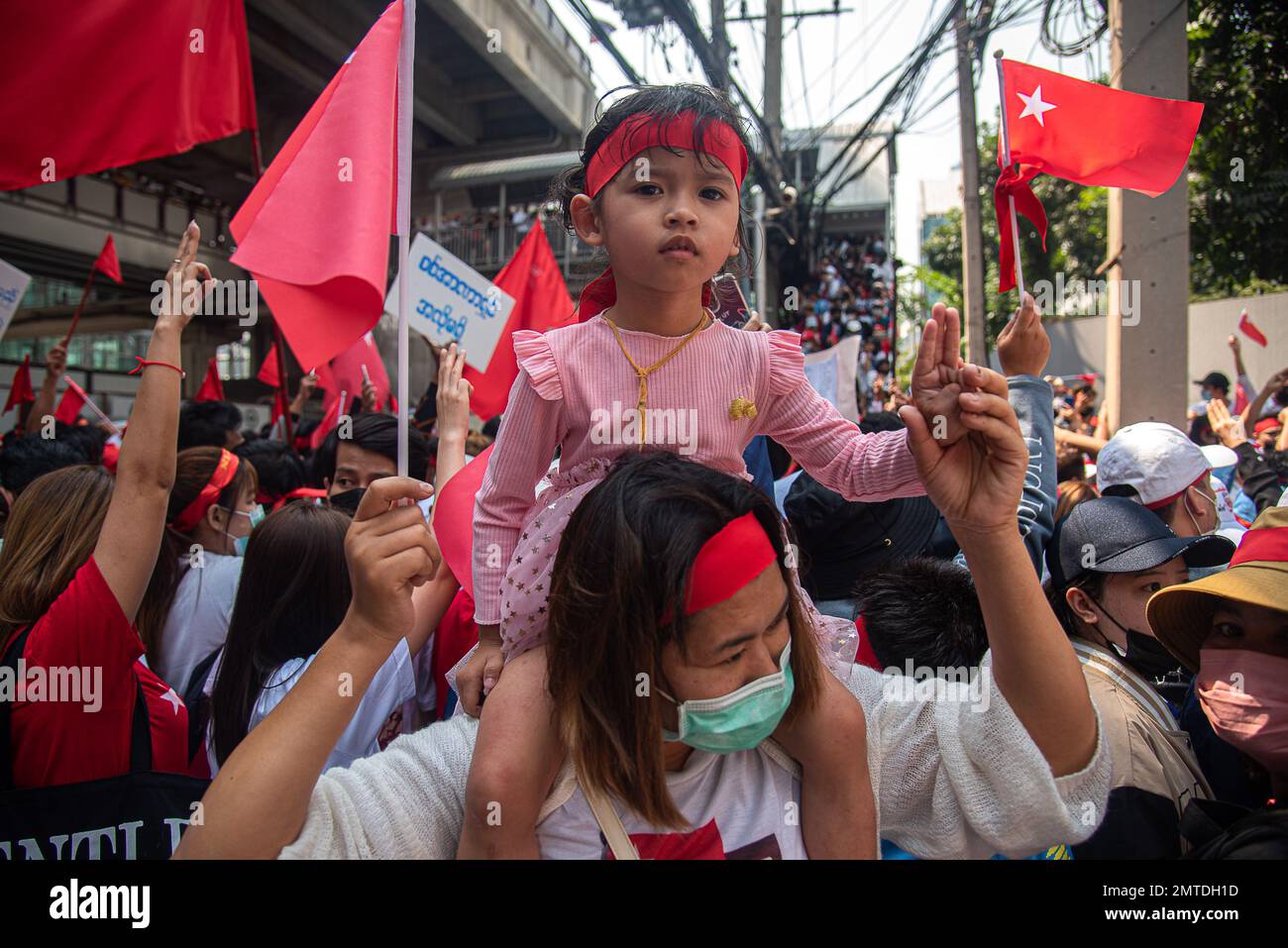 Bangkok, Thailand. 01st Feb, 2023. A kid on the shoulders of the mother ...