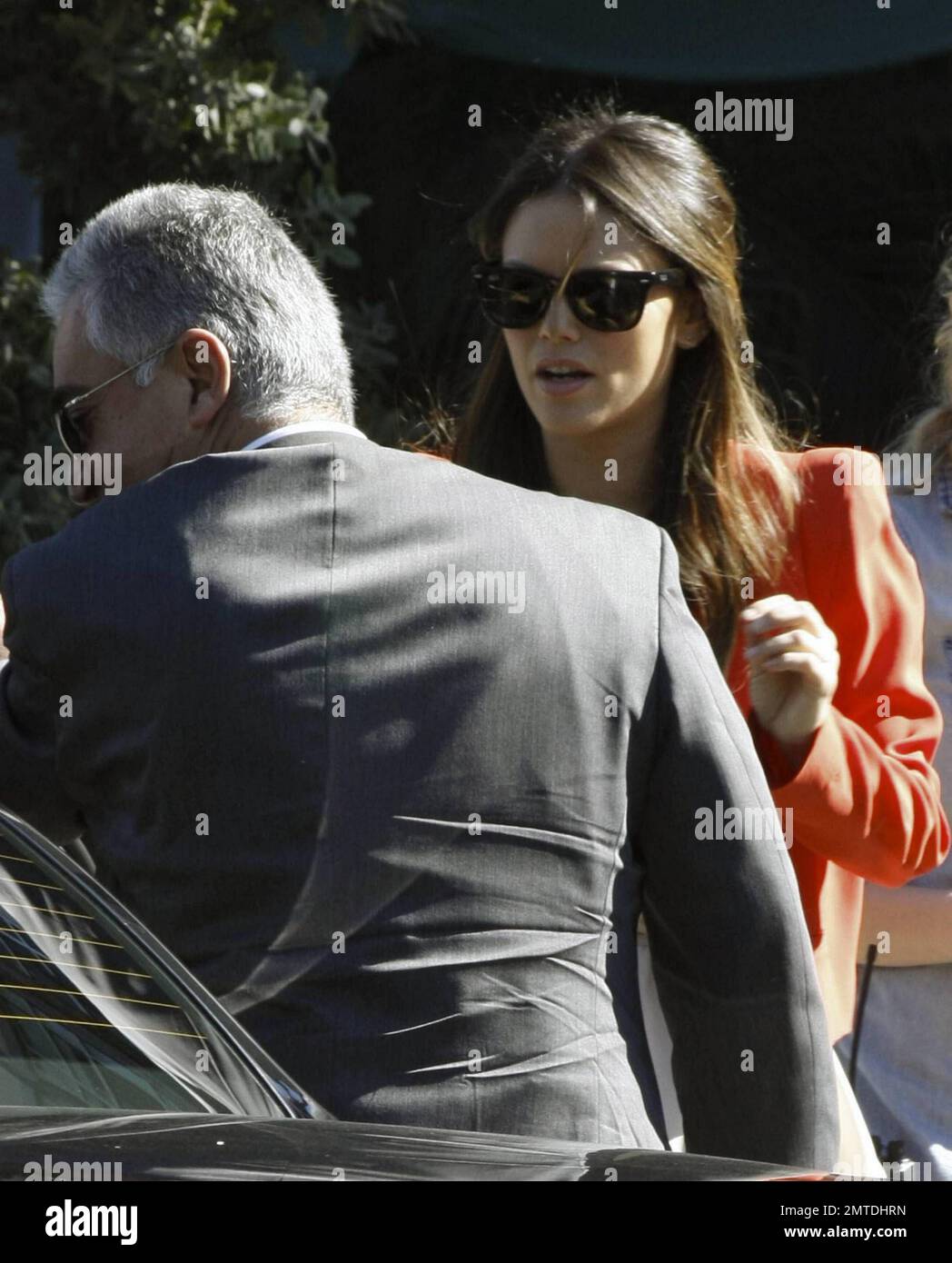 Wearing a red jacket and a simple white dress, actress Rachel Bilson leaves the "Chelsea Lately ...