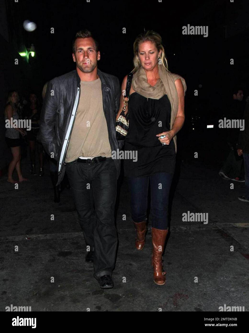 Supermodel Rachel Hunter steps out with her fiance Jarret Stoll to pay ...