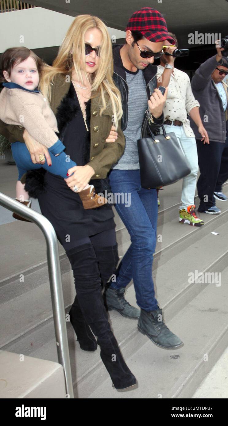 Celebrity stylist Rachel Zoe carries son Skyler as she and husband ...