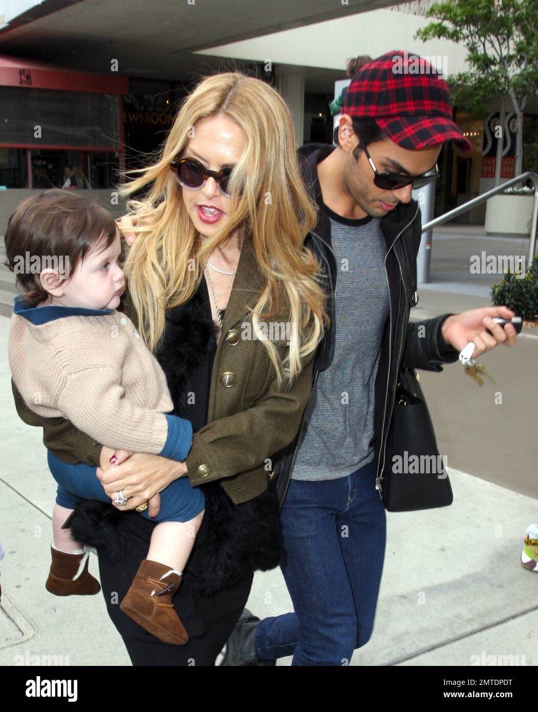 Celebrity stylist Rachel Zoe carries son Skyler as she and husband ...