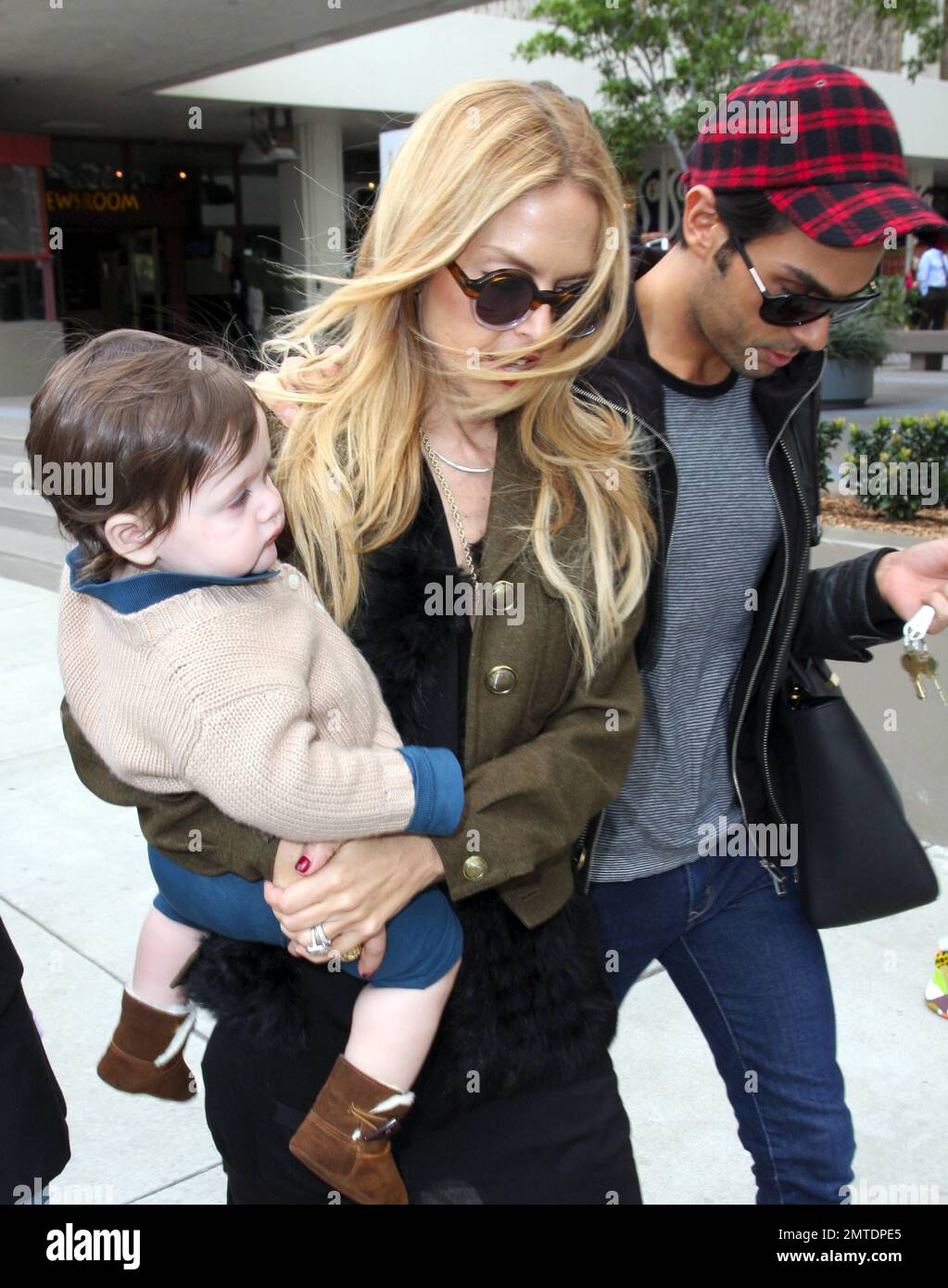 Celebrity stylist Rachel Zoe carries son Skyler as she and husband ...