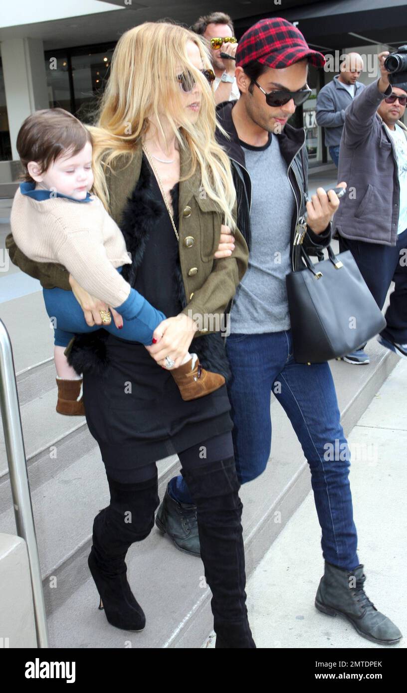Celebrity stylist Rachel Zoe carries son Skyler as she and husband ...
