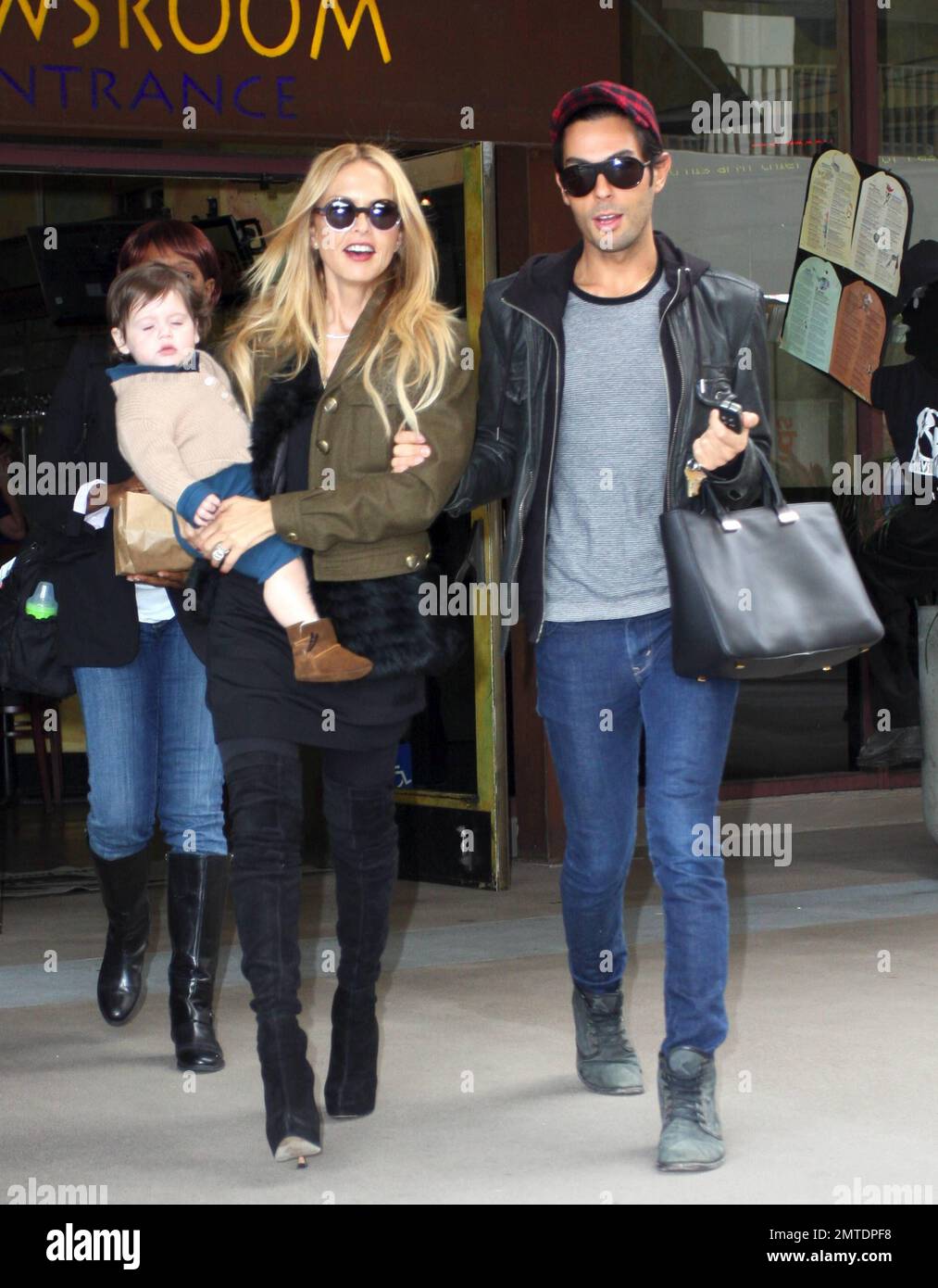 Celebrity stylist Rachel Zoe carries son Skyler as she and husband ...