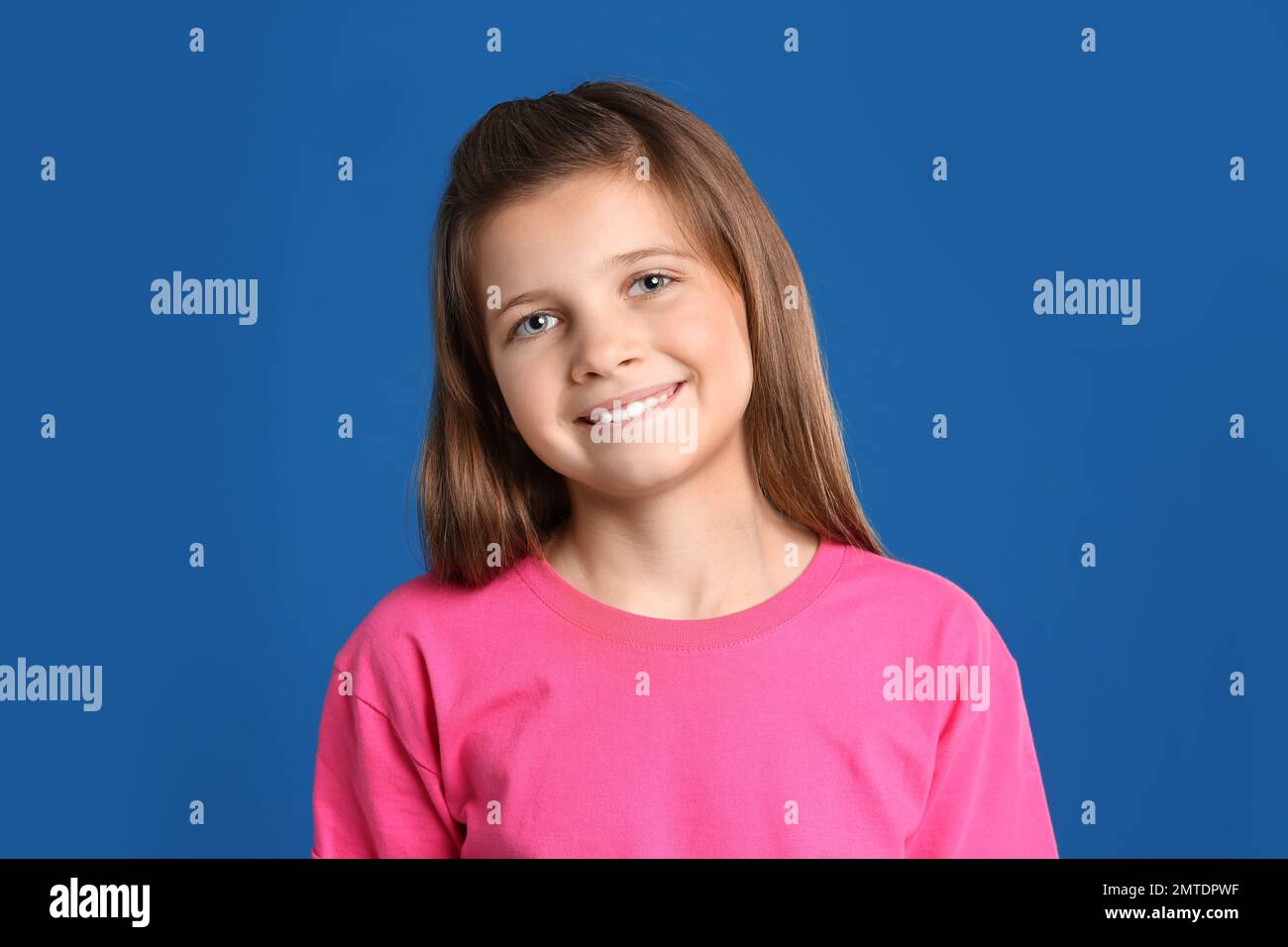 Portrait of preteen girl on blue background Stock Photo - Alamy